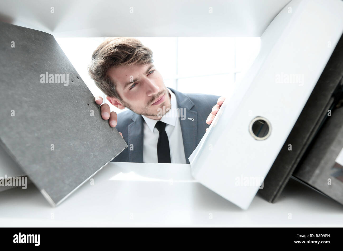 Working man looks folder documents hi-res stock photography and images ...