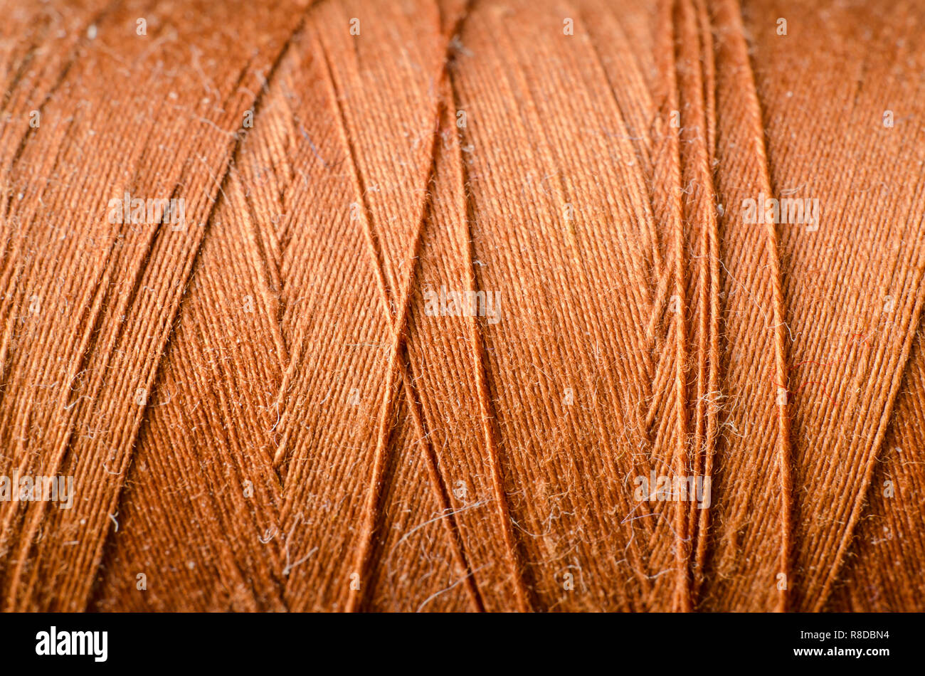 orange thread as a background Stock Photo - Alamy