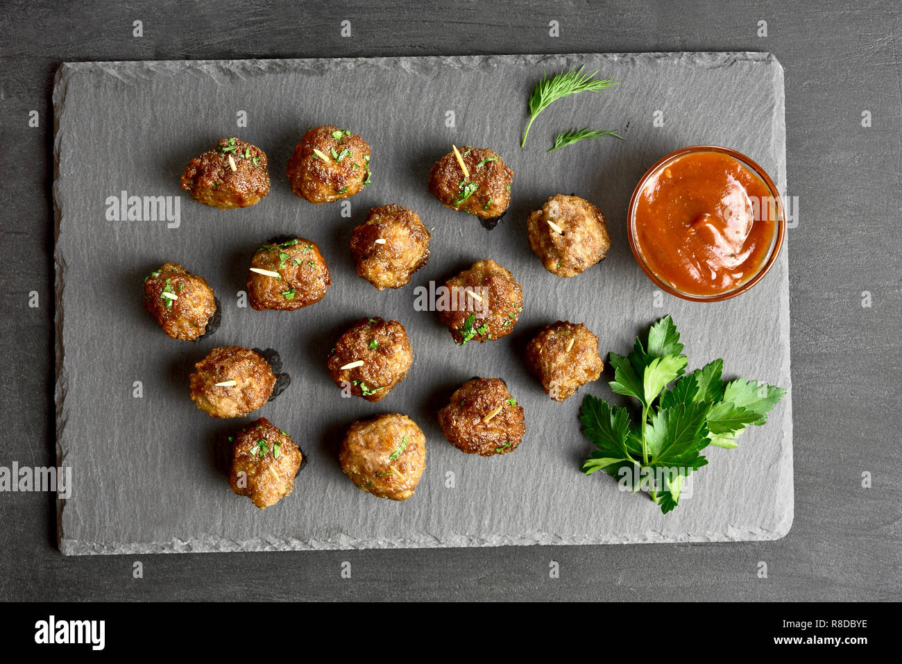 Meatballs with tomato sauce on slate board. Top view, flat lay Stock ...