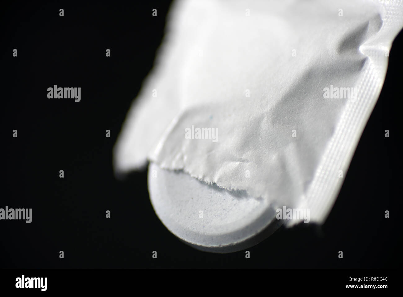 Effervescent tablet with detergent action as a tablet and crushed as a ...