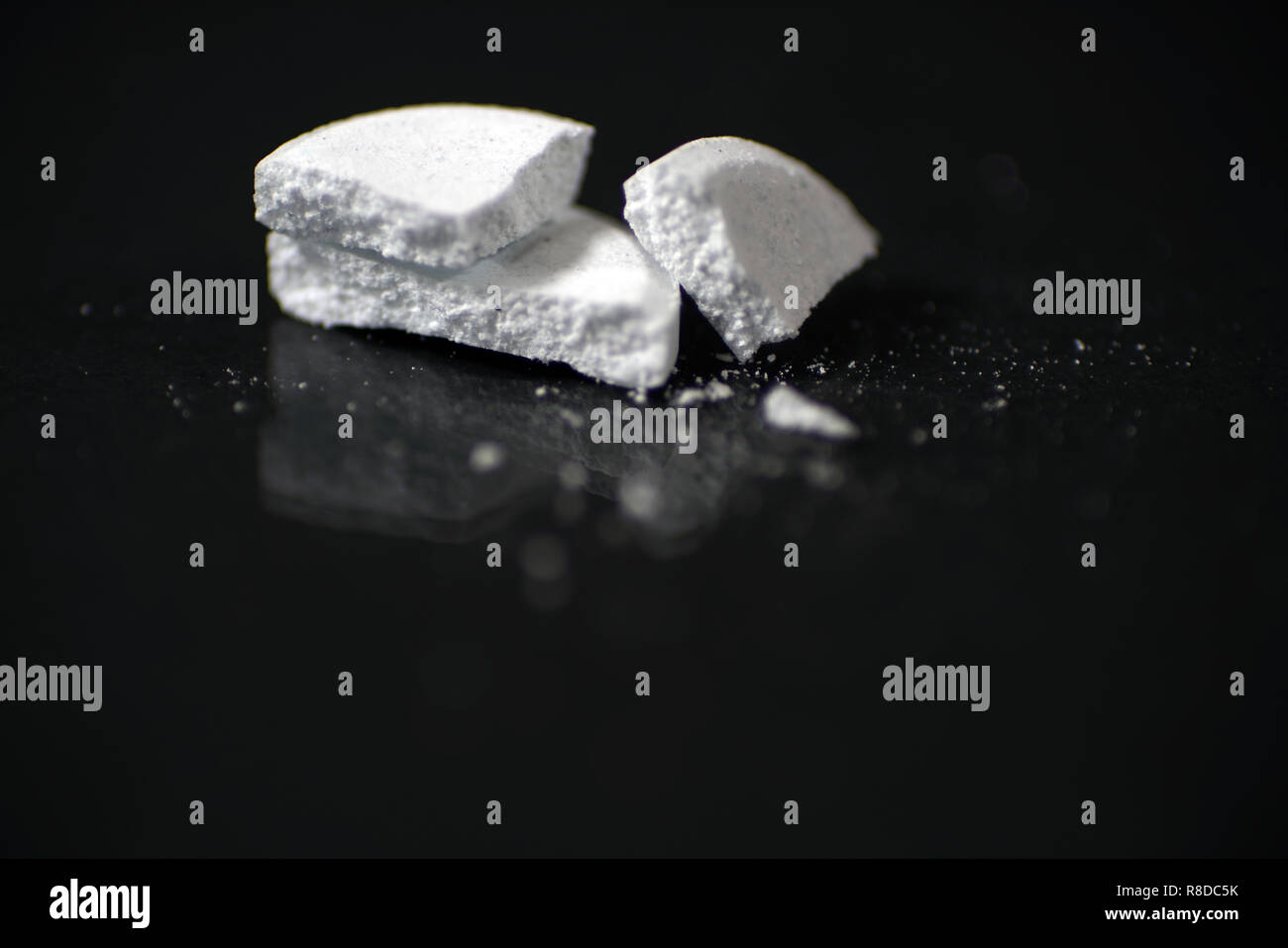 Effervescent tablet with detergent action as a tablet and crushed as a ...