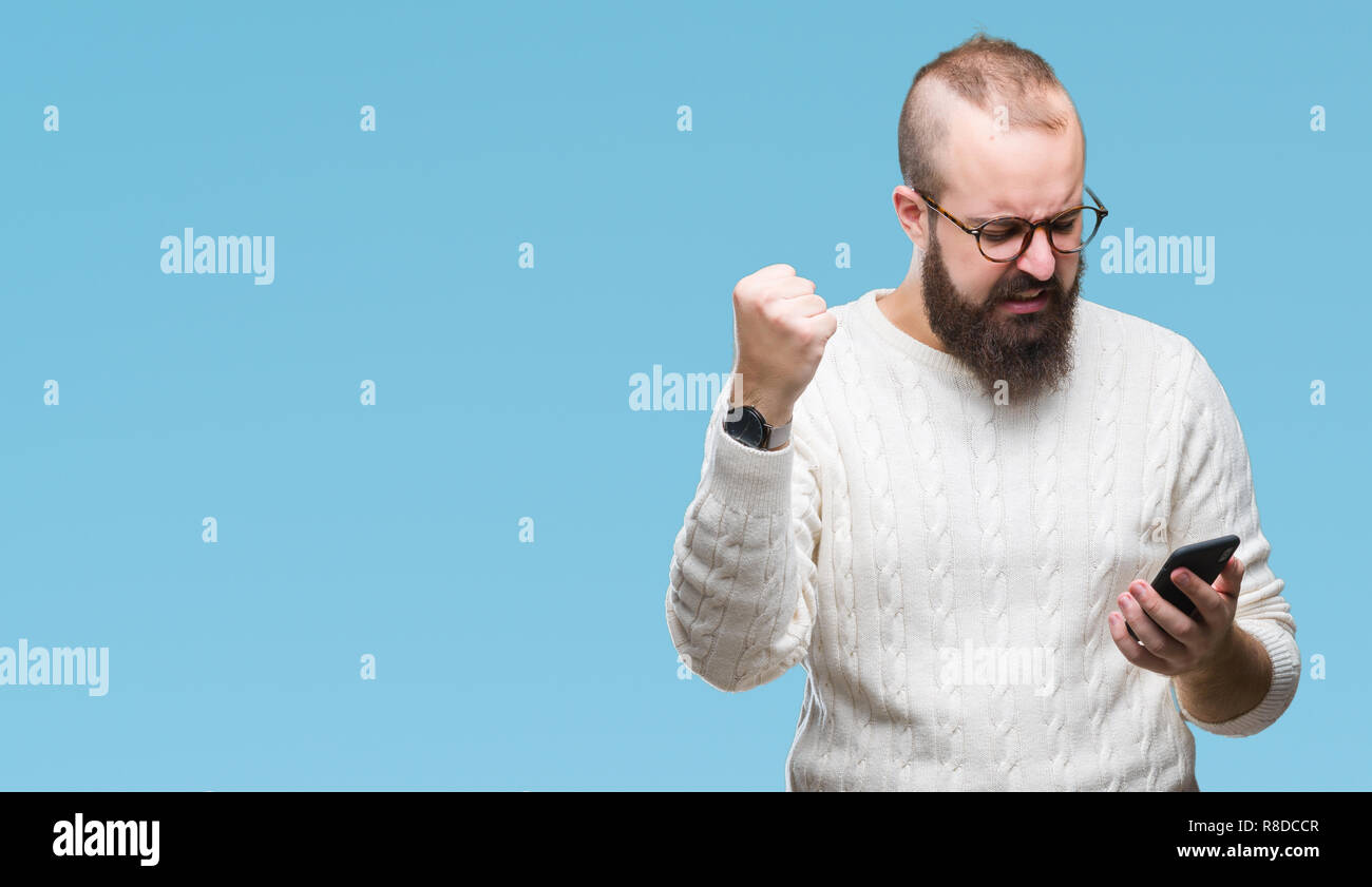 Young caucasian hipster man texting sending message using smartphone ...