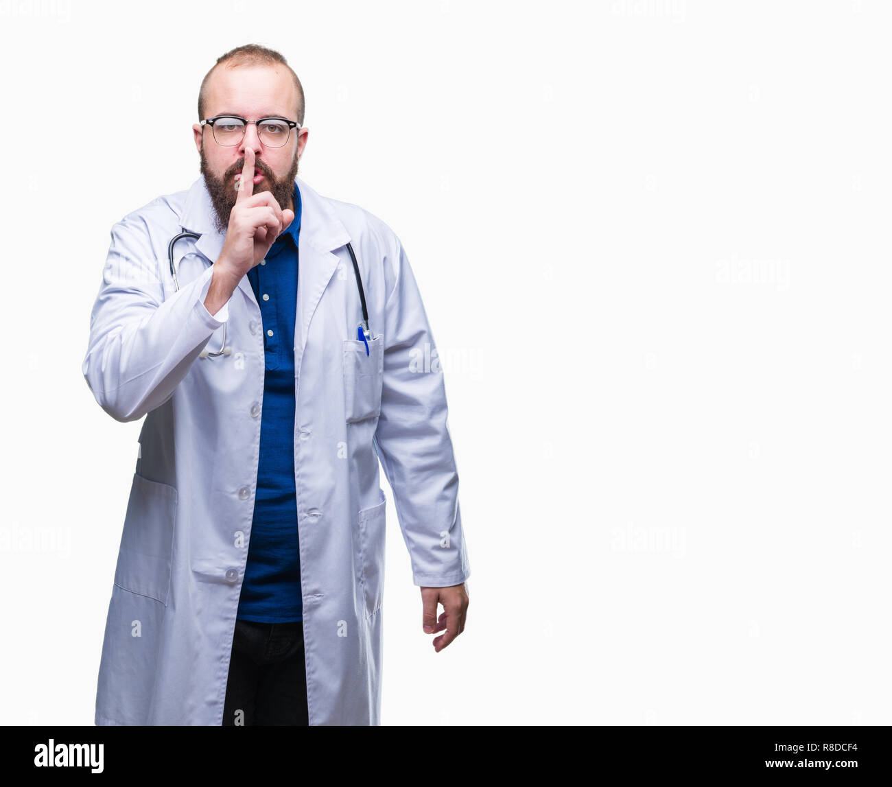 Young caucasian doctor man wearing medical white coat over isolated ...