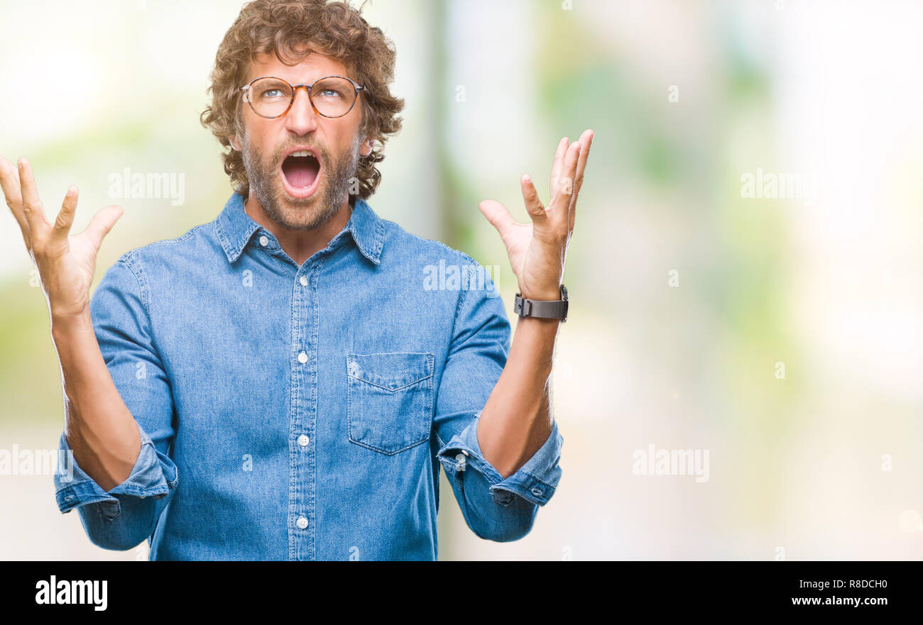 Handsome hispanic model man wearing glasses over isolated background ...