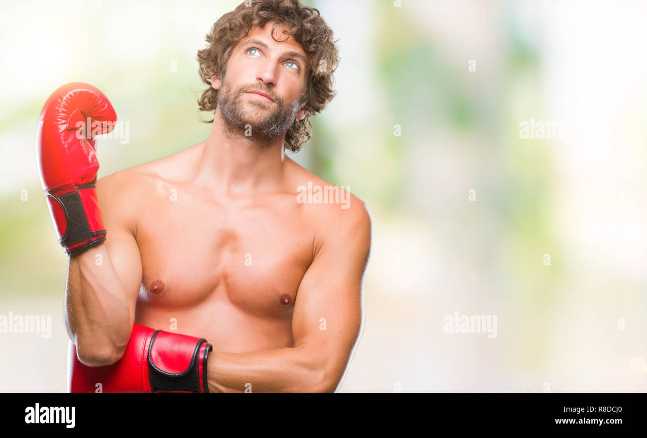 Handsome hispanic boxer man wearing boxing gloves over isolated ...