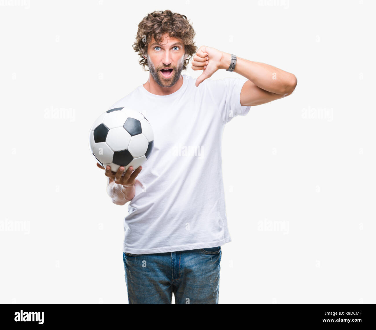 Handsome hispanic man model holding soccer football ball over isolated ...