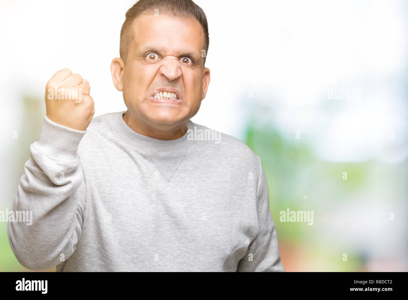 Middle age arab man wearing sport sweatshirt over isolated background ...