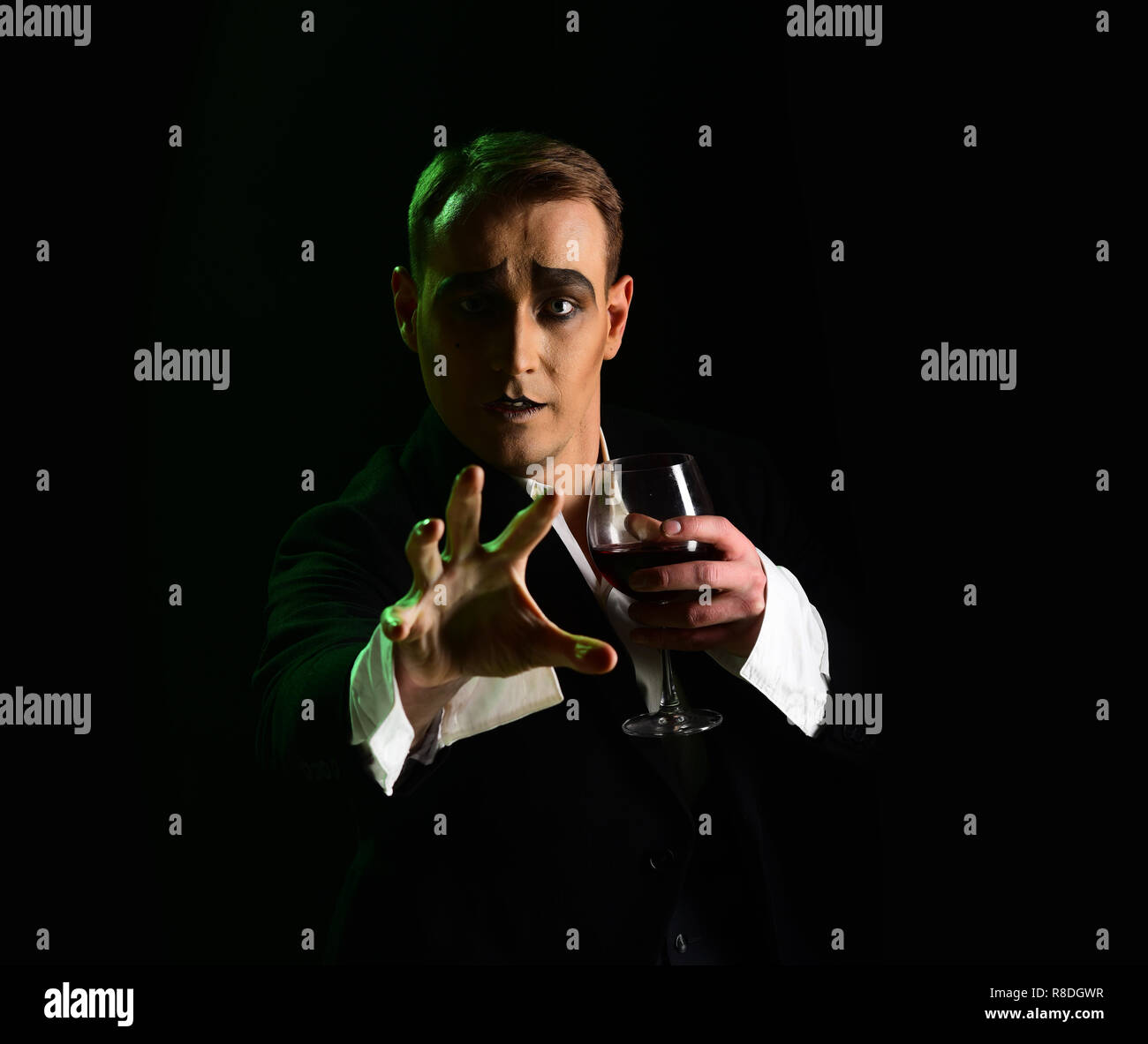 Wait. Mime artist perform on stage. Stage actor pantomime drinking wine ...