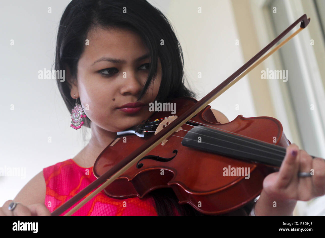Indian girl playing violin hi-res stock photography and images - Alamy