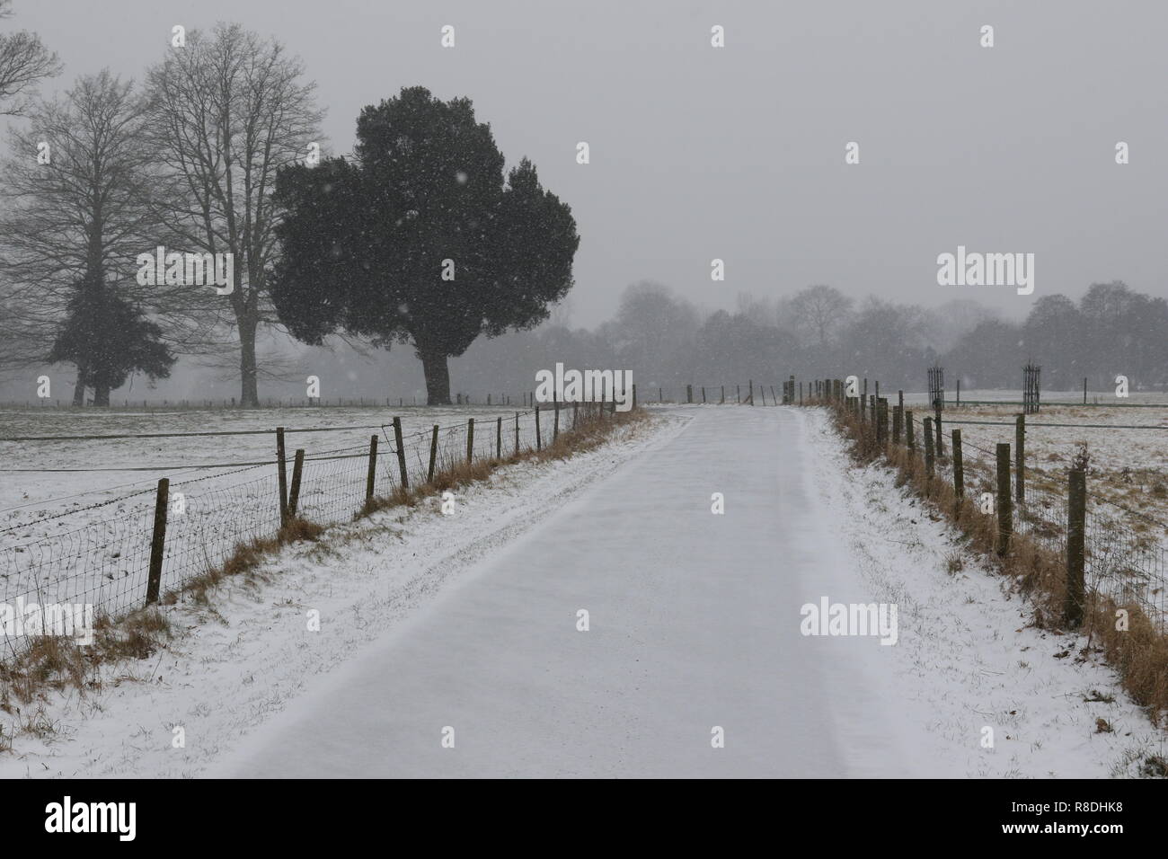 Snow on country road Stock Photo - Alamy