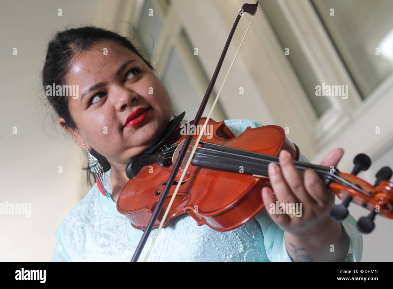 Beautiful woman playing violin hi-res stock photography and images - Alamy