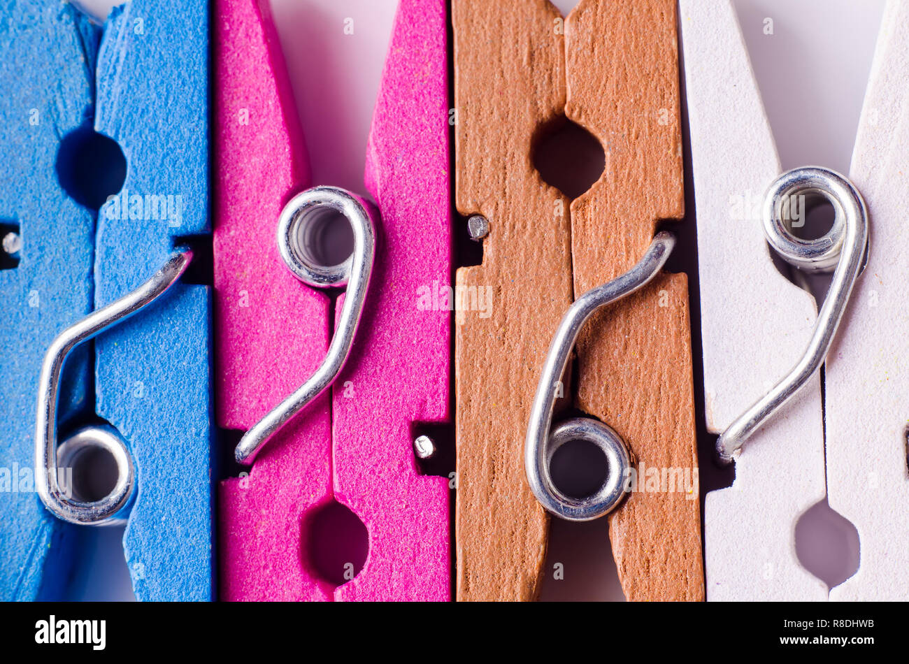 a row of color wooden clothespins Stock Photo - Alamy