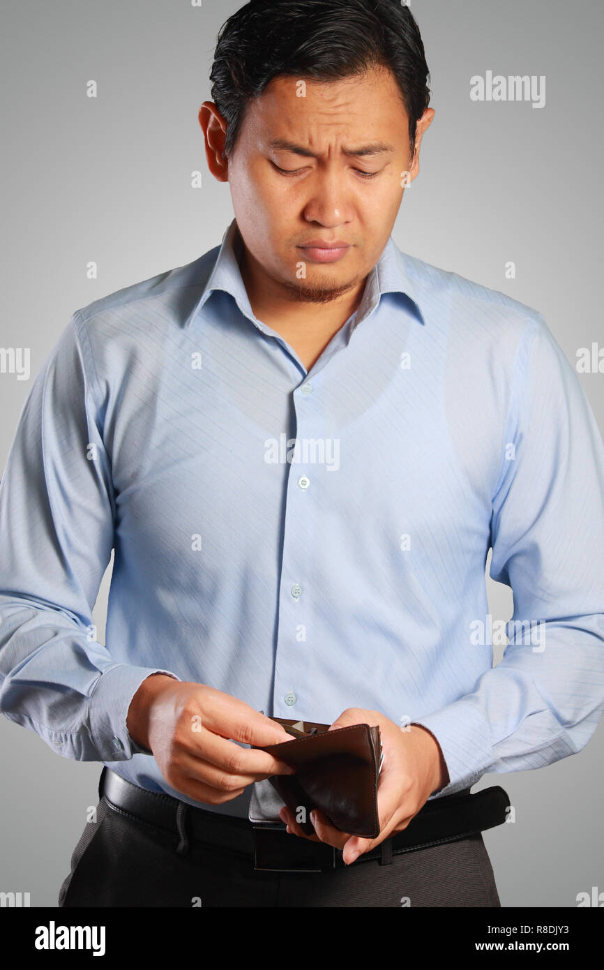 Photo image portrait of a young Asian businessman with empty wallet, no ...
