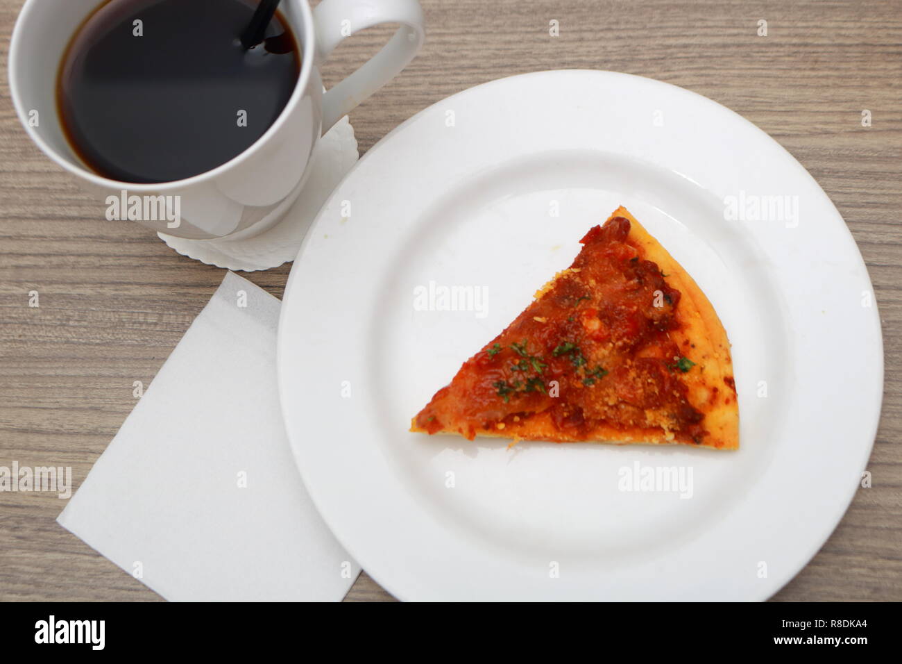 Top view slice of pizza and cup of morning coffee with blank paper ...