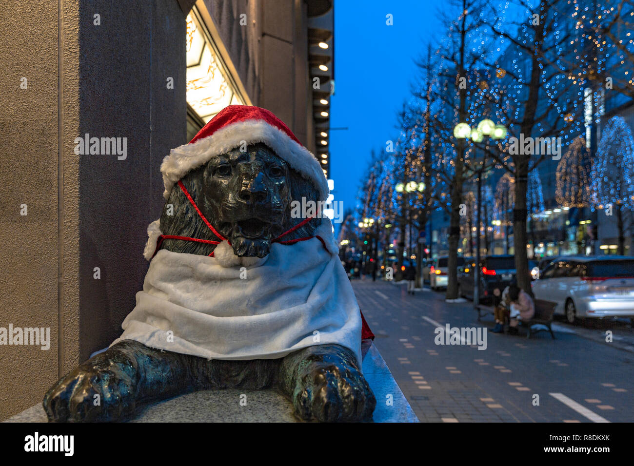 Statue of a lion dressed in christmas clothes in downtown Sapporo ...