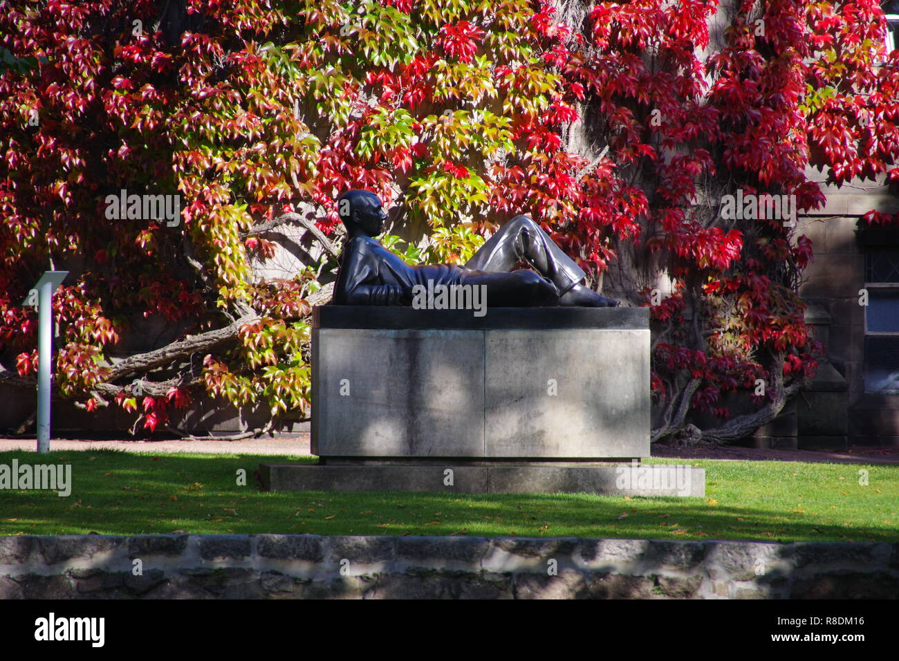 Lounging Young Man Statue by New Kings Lecture Building, Festooned in ...