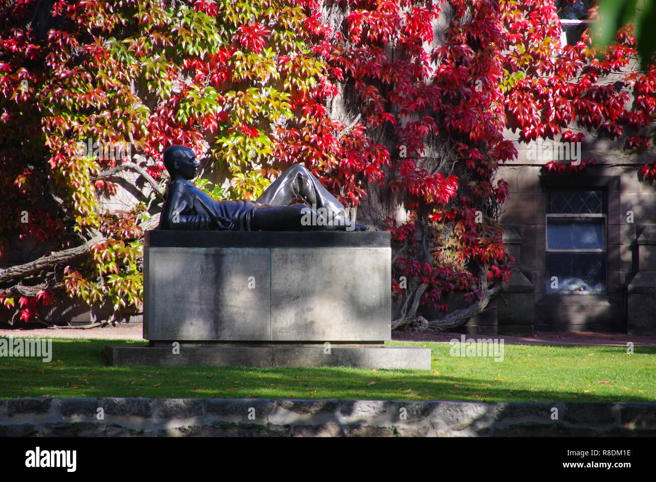 Lounging Young Man Statue by New Kings Lecture Building, Festooned in ...
