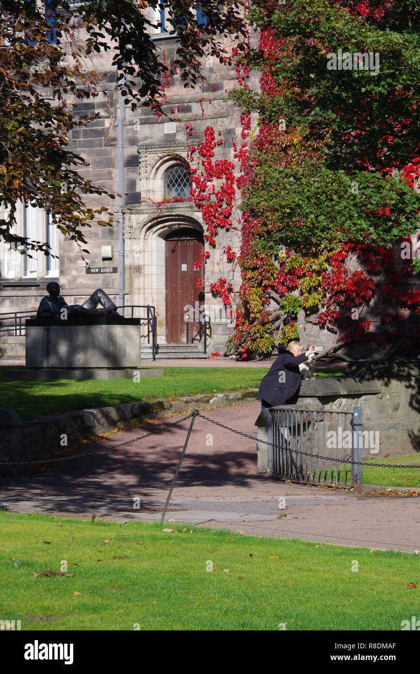 Lounging Young Man Statue by New Kings Lecture Building, Festooned in ...