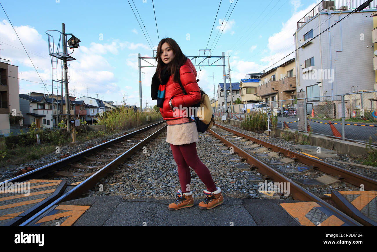 cool girl walk through the railway Stock Photo - Alamy