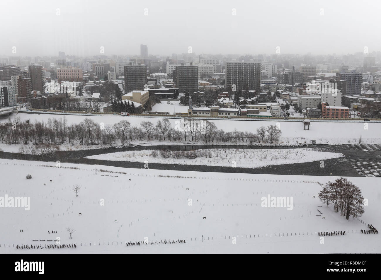 Aerial view of Sapporo City by Toyohira riverside in winter. Hokkaido ...