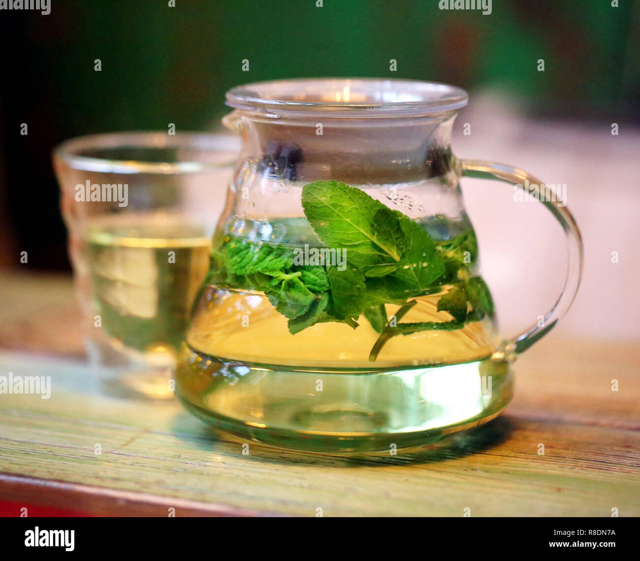 Bright photo background macro big tea mint in a teapot in a cafe Stock ...
