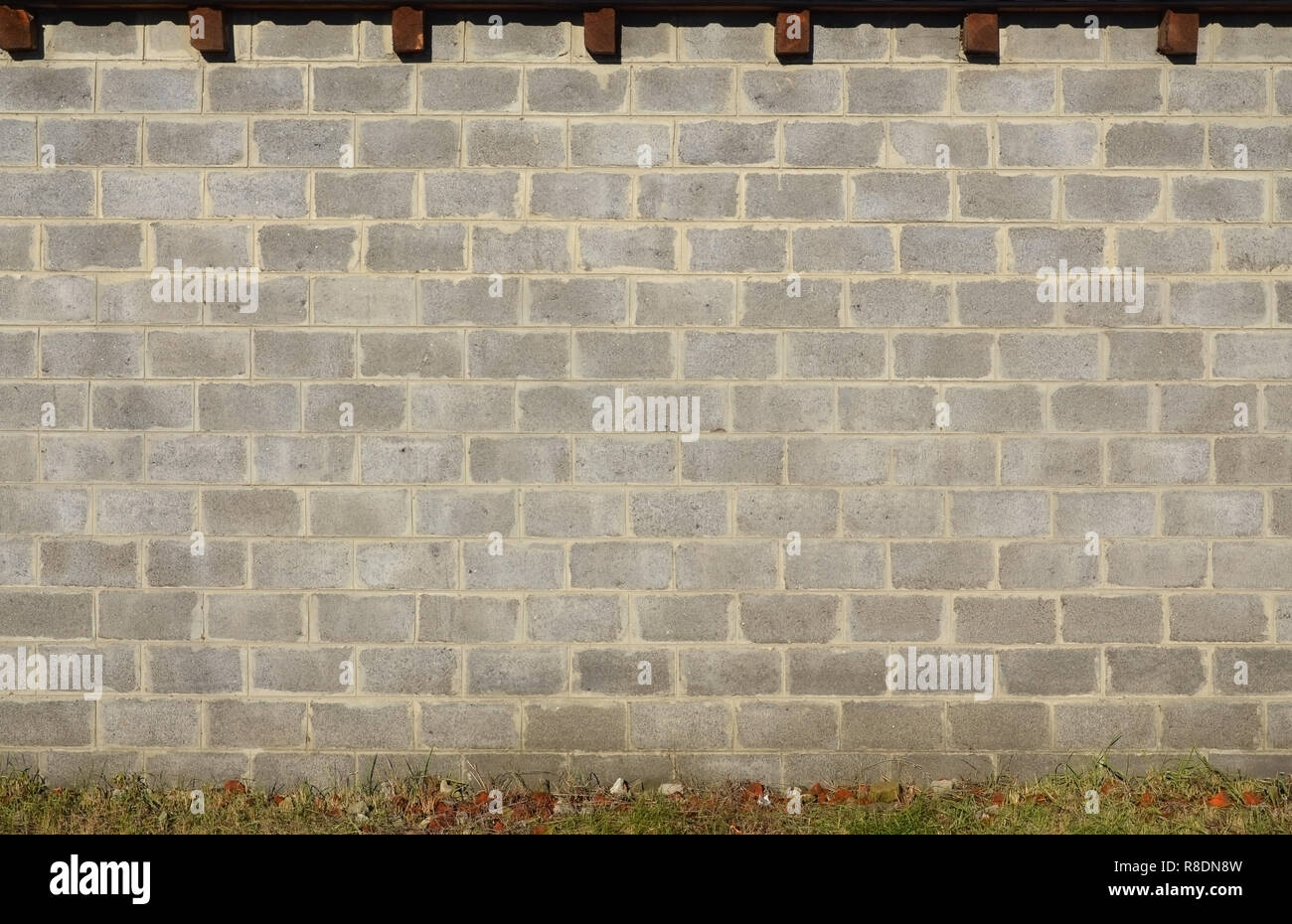 Weathered stained old block wall background. Texture of an old wall of ...