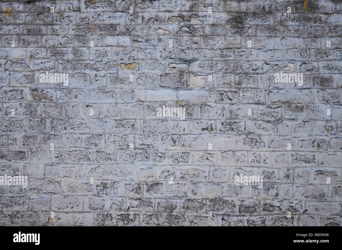 Weathered stained old block wall background. Texture of an old wall of ...