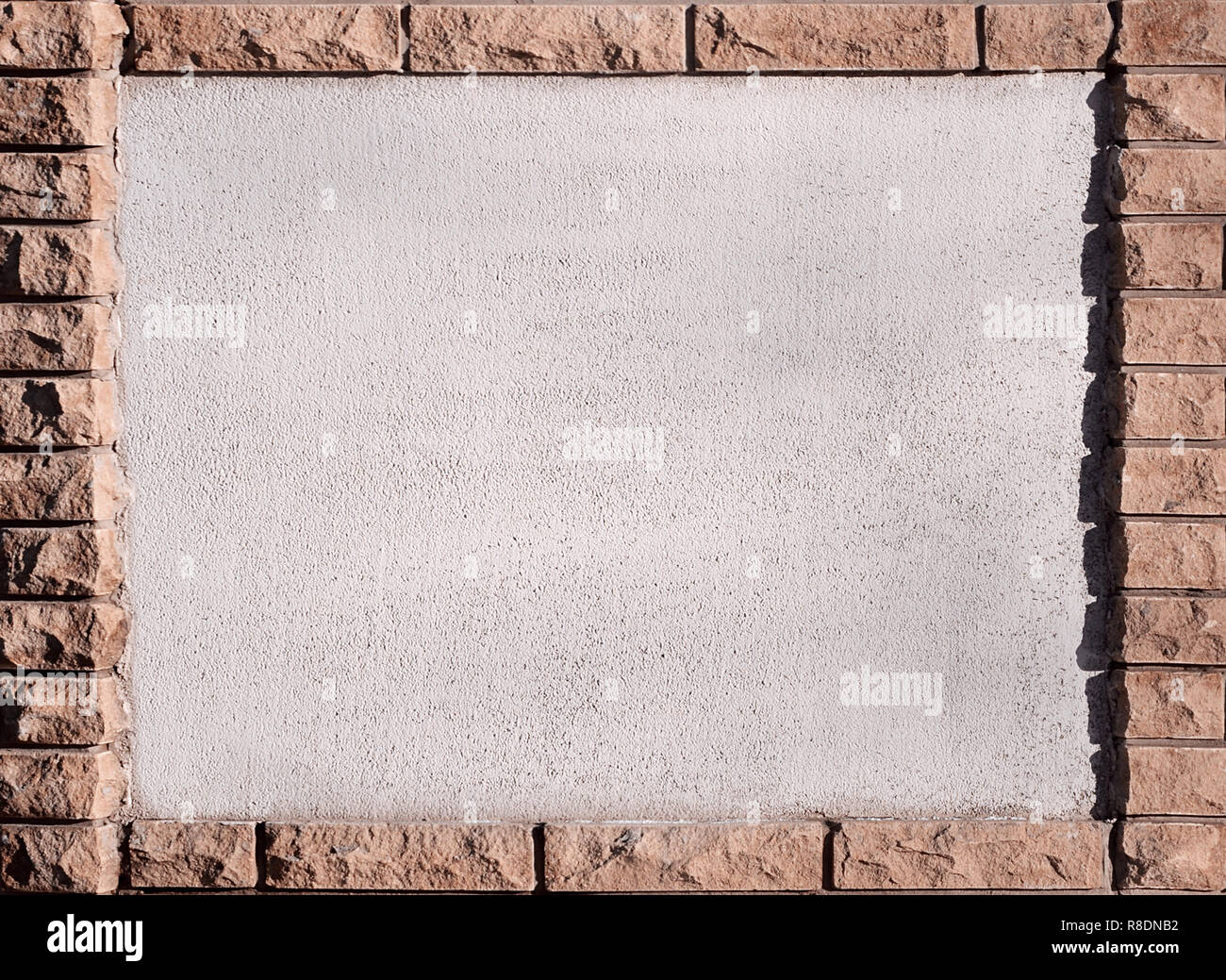 Frame made of masonry. Brick frame around the clean and light concrete ...