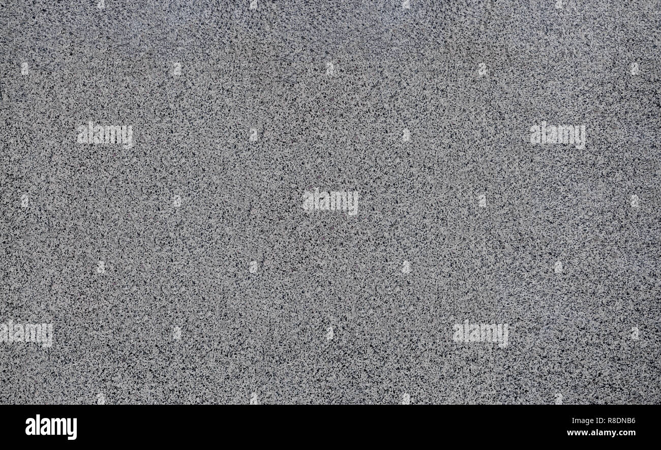 The texture of solid granite tiles. Hard and slippery gray granite ...