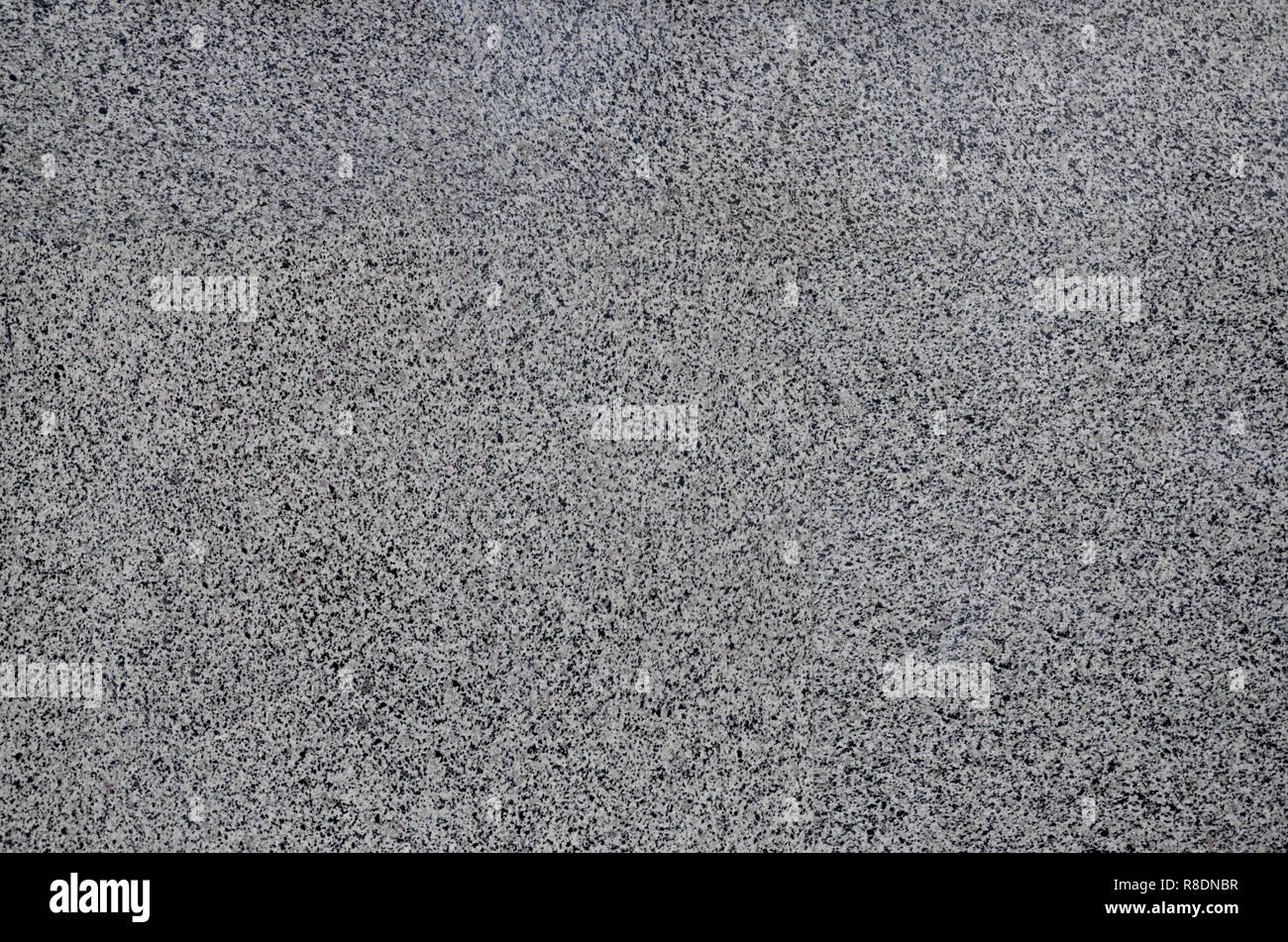 The texture of solid granite tiles. Hard and slippery gray granite ...