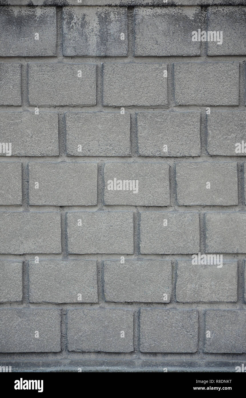 Weathered stained old block wall background. Texture of an old wall of ...