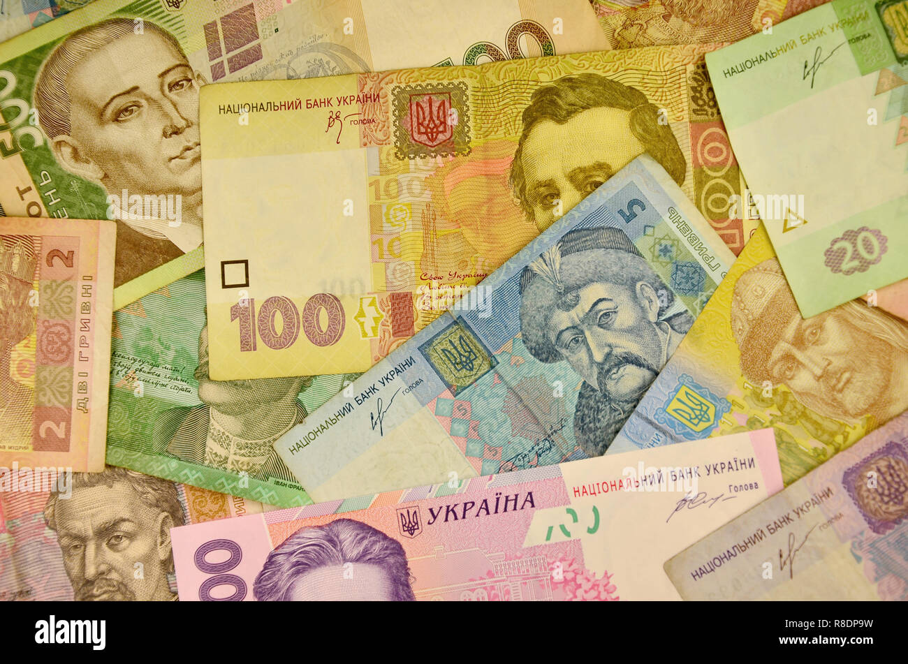 Many Ukrainian money bills of various denominations and colors ...
