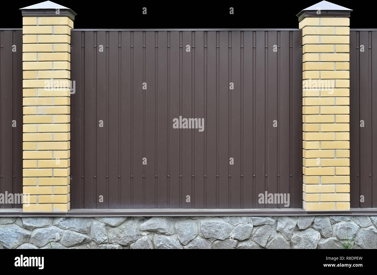 Weathered stained metal wall texture with stone foundation. Metal wall ...