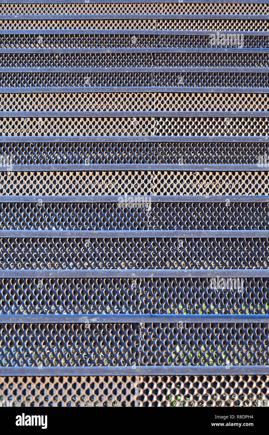Texture steps of rusty metal mesh in the sections of the metal strips ...