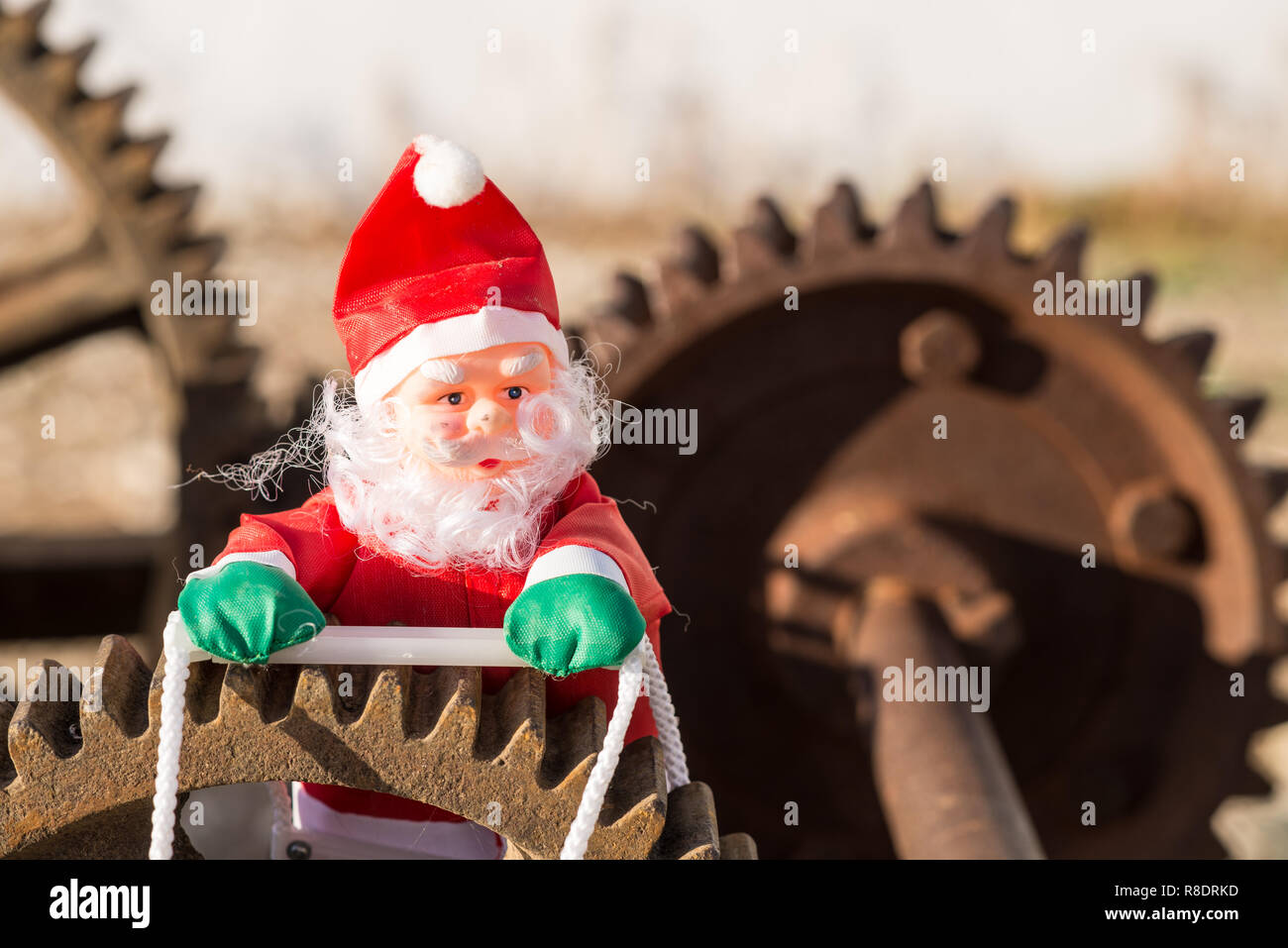 Santa in the cogwheels of consumerism, a concept Stock Photo - Alamy