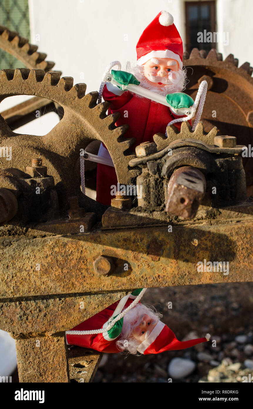 Santa in the cogwheels of consumerism, a concept Stock Photo - Alamy