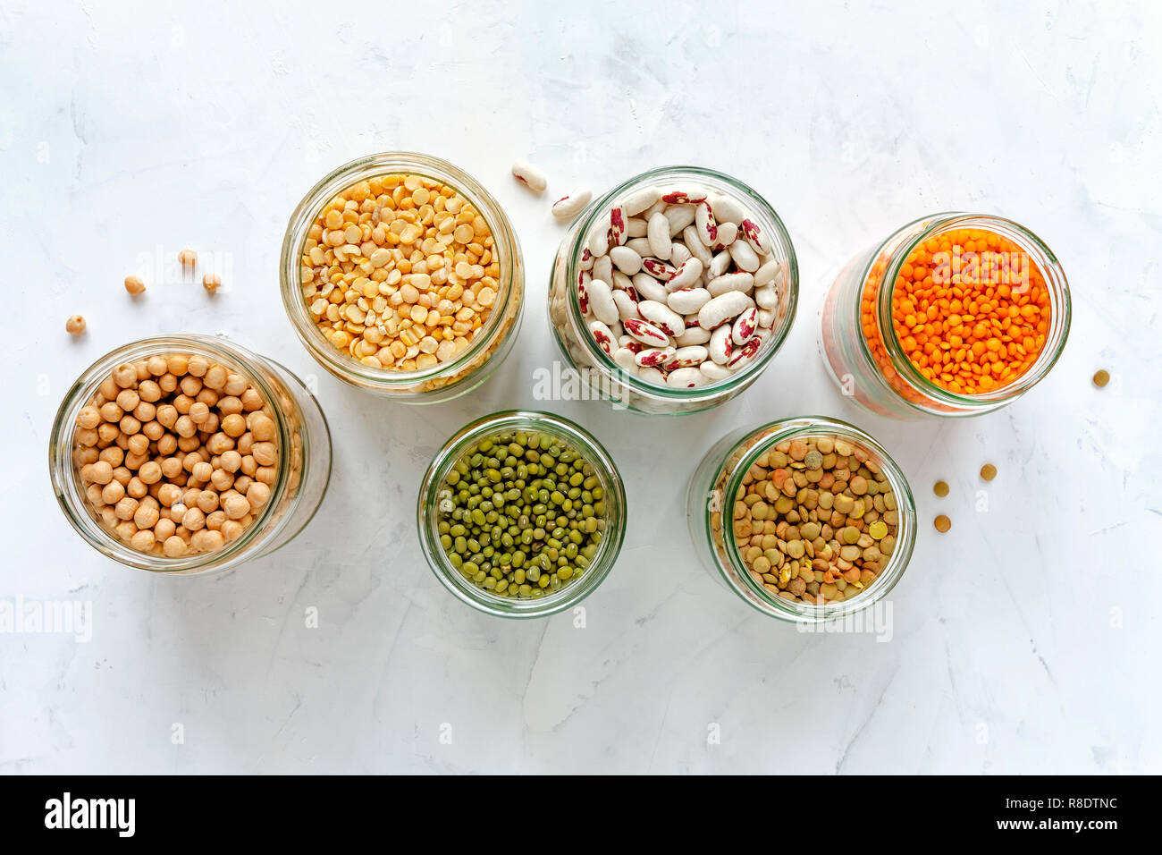 Dried assorted varieties of lentils, peas, mung beans and beans in open ...