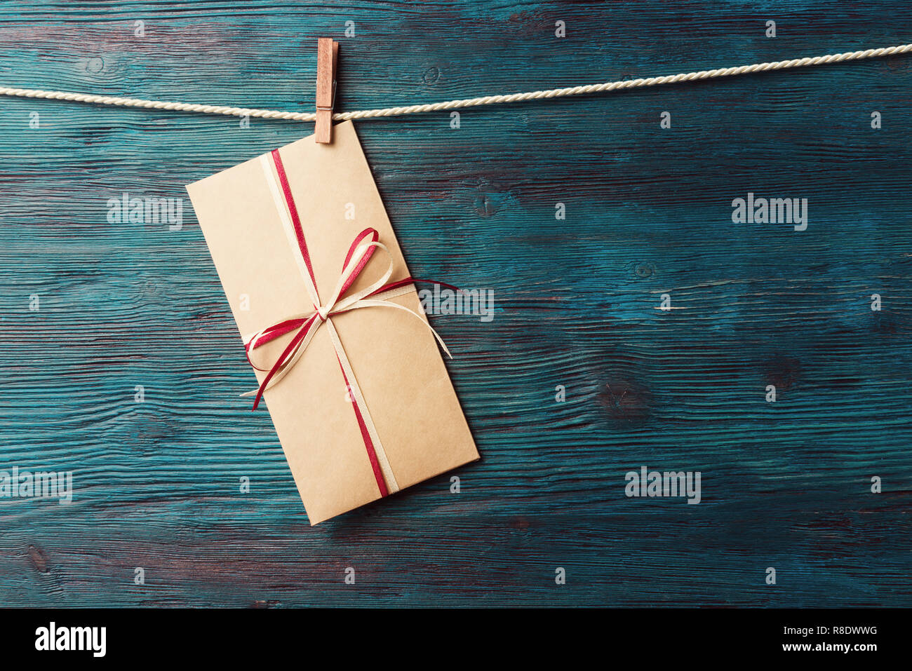 Greeting card in envelope over rustic wooden background Stock Photo - Alamy