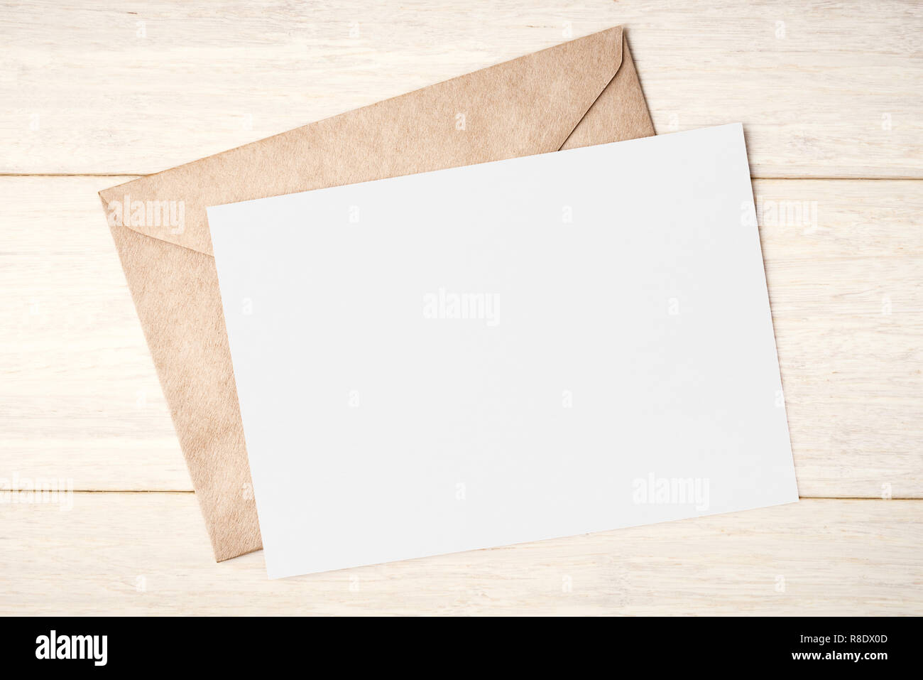 Blank white card and envelope on wooden table Stock Photo - Alamy