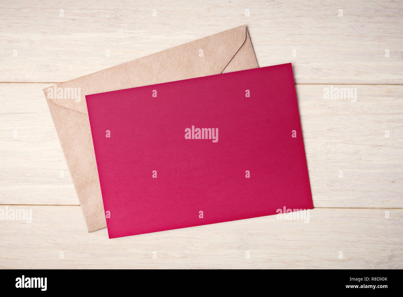 Blank red card and envelope on wooden table Stock Photo - Alamy