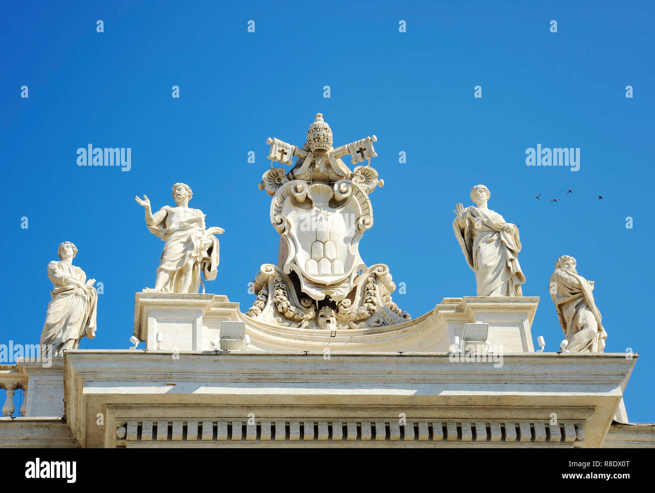 Detail from baroque Saint Peter's colonnade with beautiful statues of ...