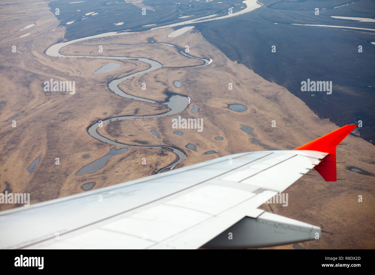 Spring land view from airplane window during landing in Khabarovsk ...