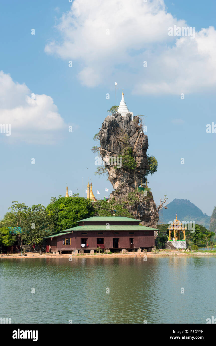 Vertical picture of Kyaut Ka Latt Pagoda built over the cliff in Hpa An ...