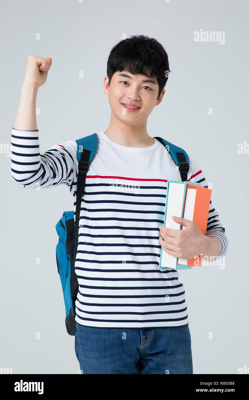 Portrait of a cheerful young man wearing back pack isolated photo 023 ...