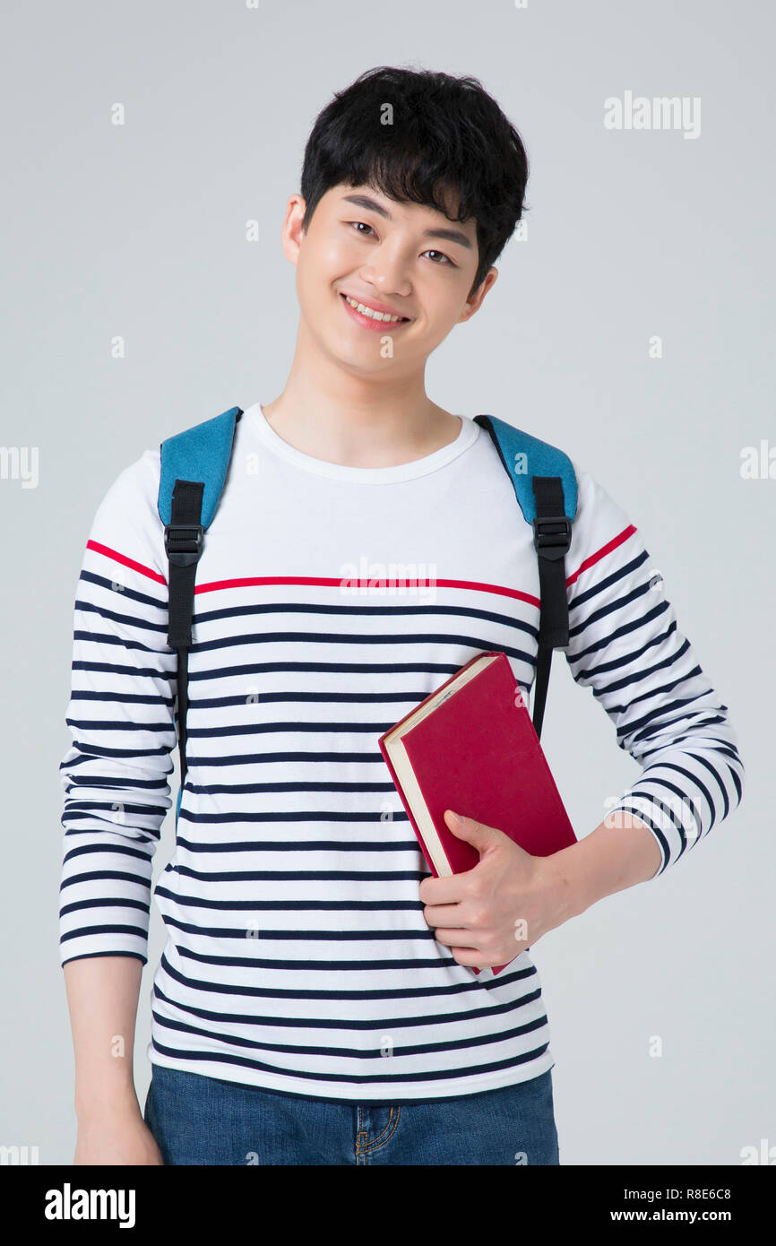Portrait of a cheerful young man wearing back pack isolated photo 004 ...