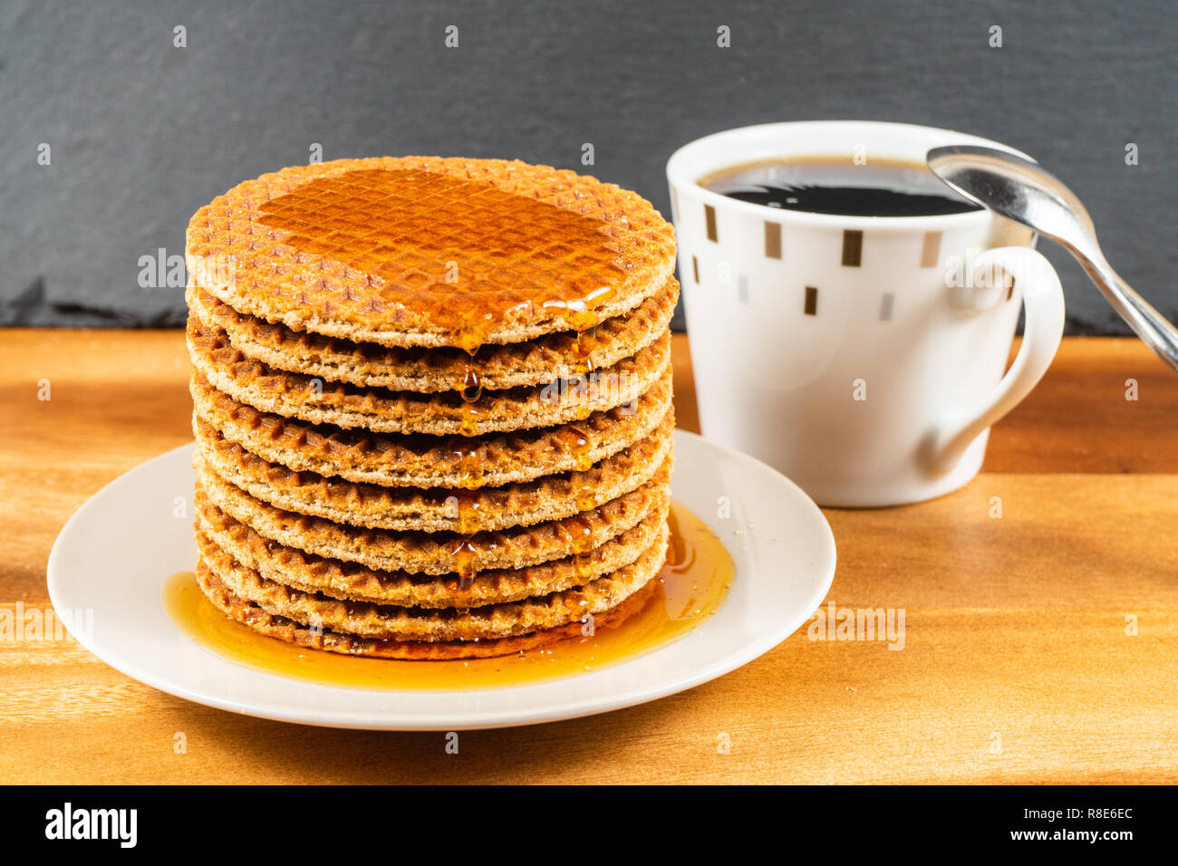 Waffles with hot maple syrup.Honey pouring on a fresh waffles Stock ...