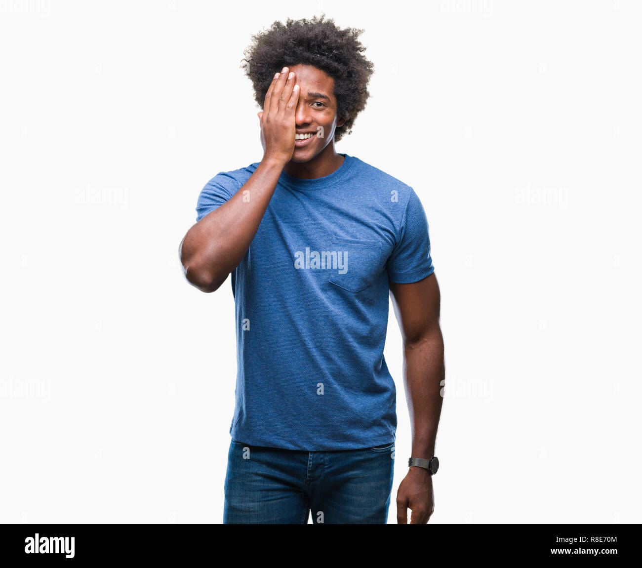 Afro american man over isolated background covering one eye with hand ...