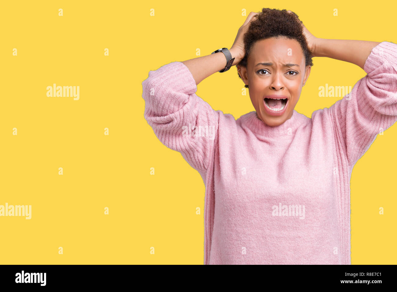 Beautiful young african american woman over isolated background Crazy ...