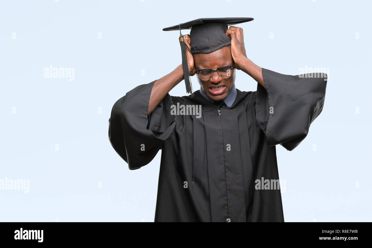 Young graduated african american man over isolated background suffering ...