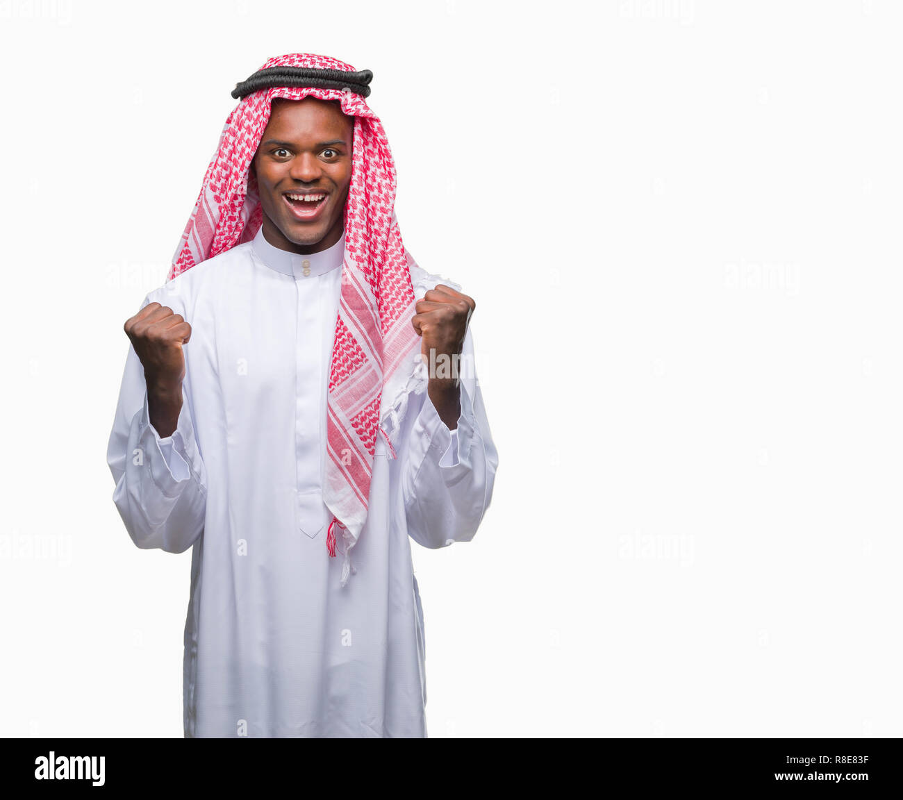 Young arabic african man wearing traditional keffiyeh over isolated ...